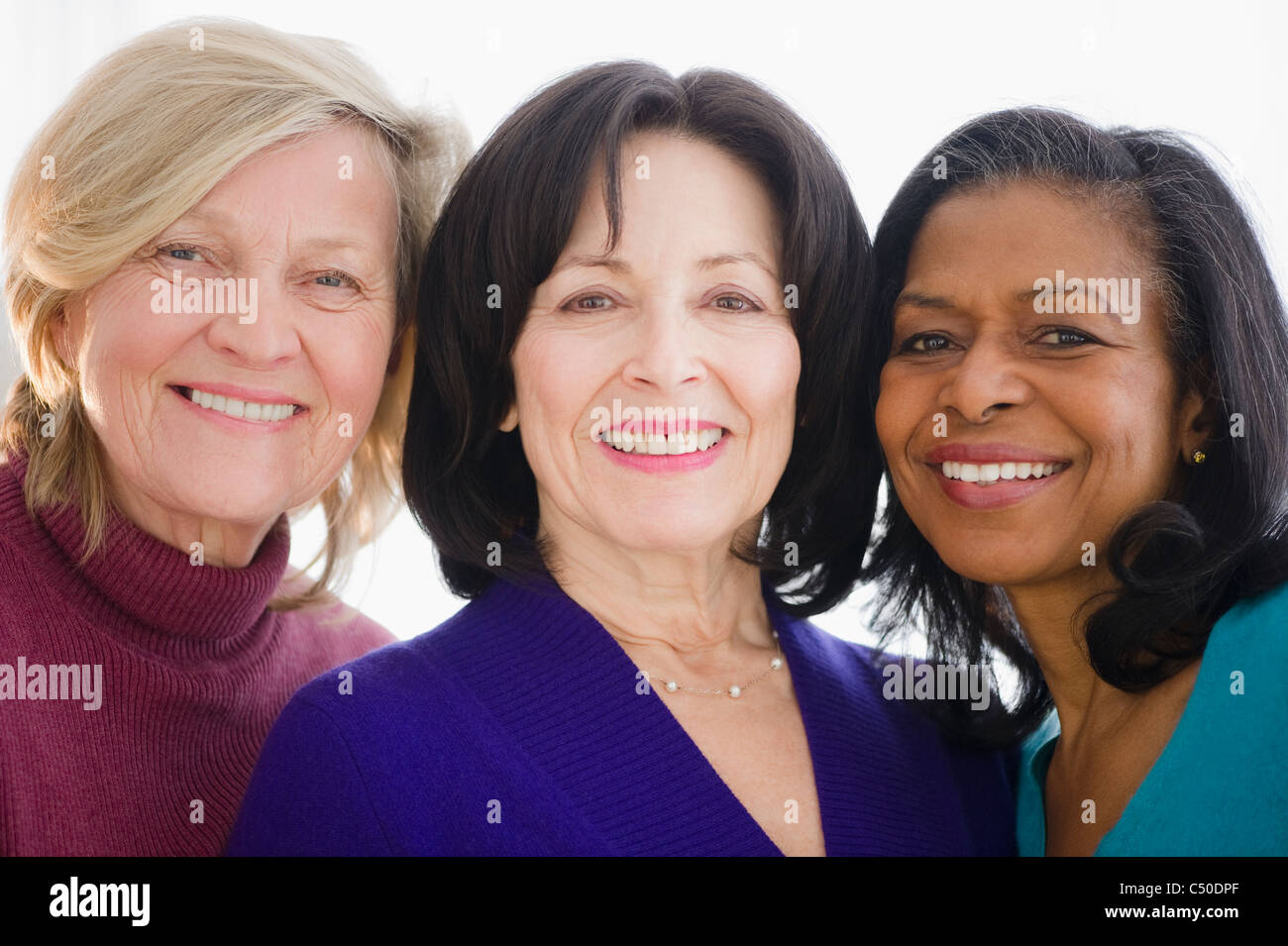 Friends smiling together Stock Photo - Alamy