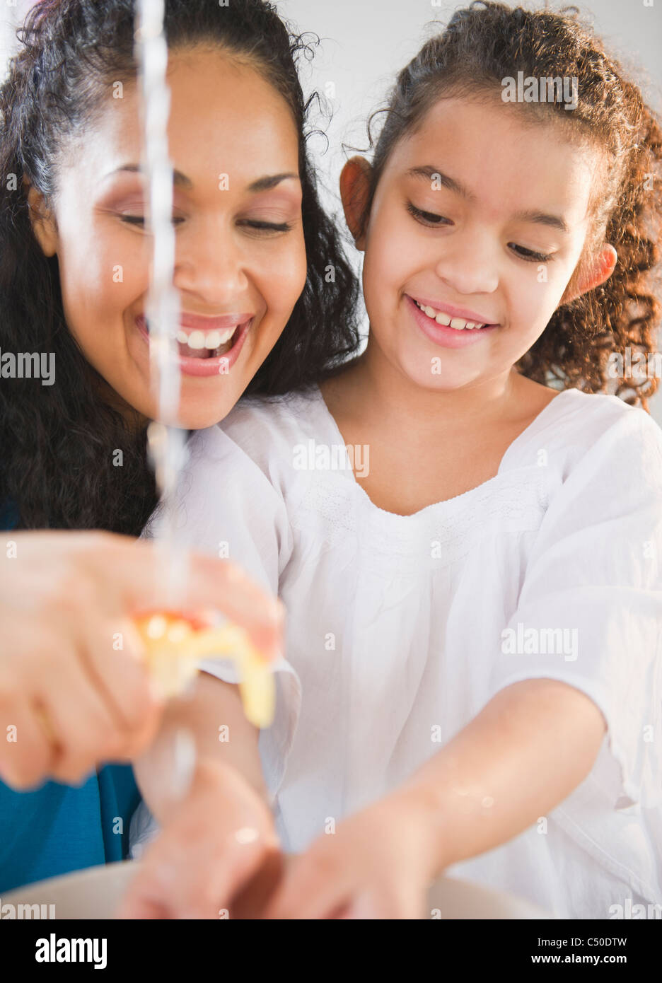 Mother helping daughter washer her hands Stock Photo - Alamy
