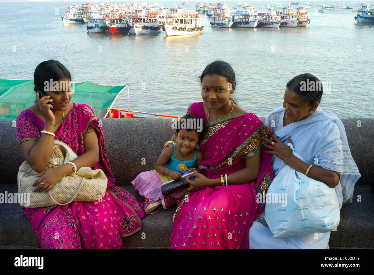Indian women resting at Gateway of India, the southern tip of Bombay ...