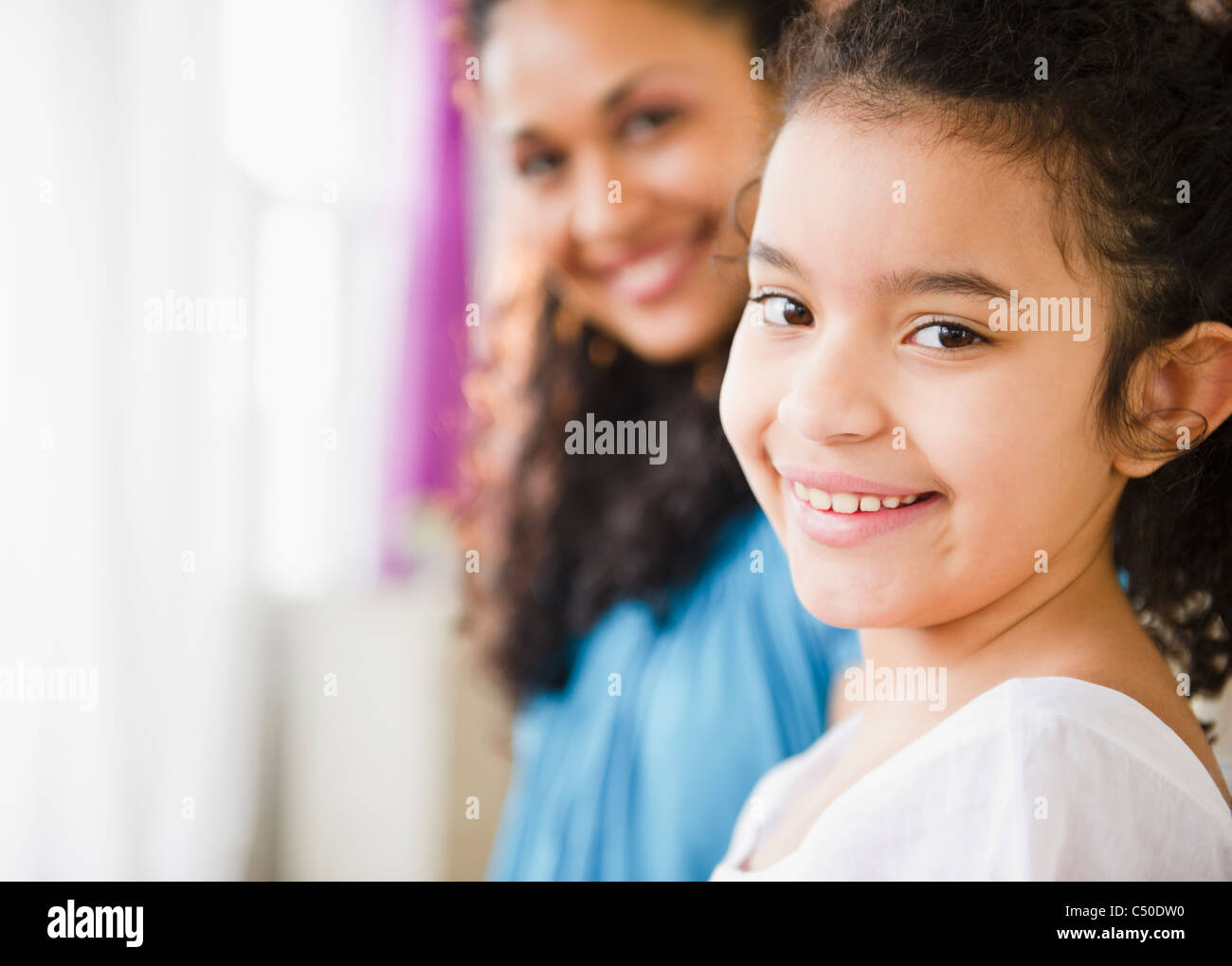Smiling mother and daughter Stock Photo - Alamy