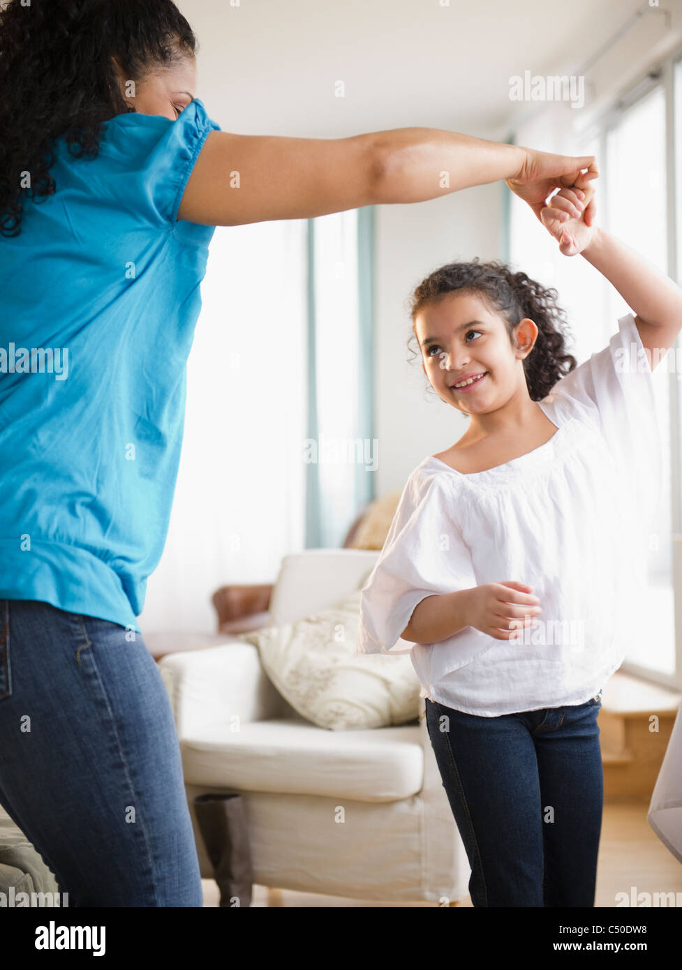 Mother and daughter dancing Stock Photo - Alamy