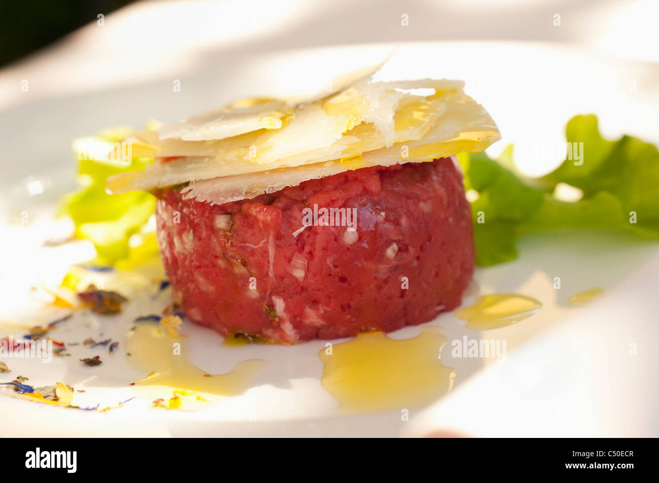 Parmesan cheese atop steak tartare Stock Photo - Alamy
