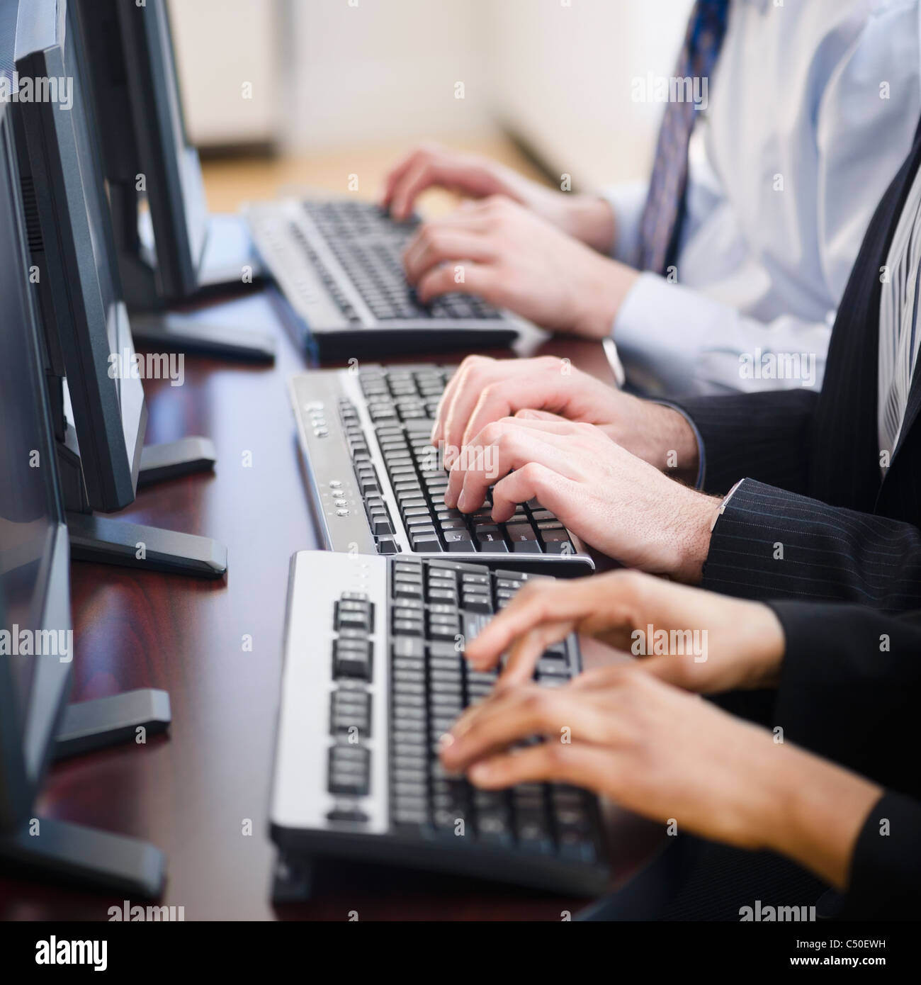 Business people working together in office on computers Stock Photo - Alamy