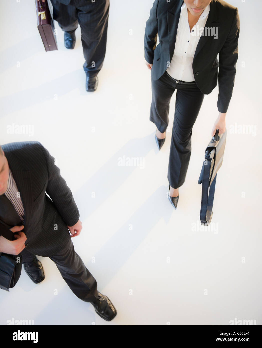 Business people walking together Stock Photo - Alamy