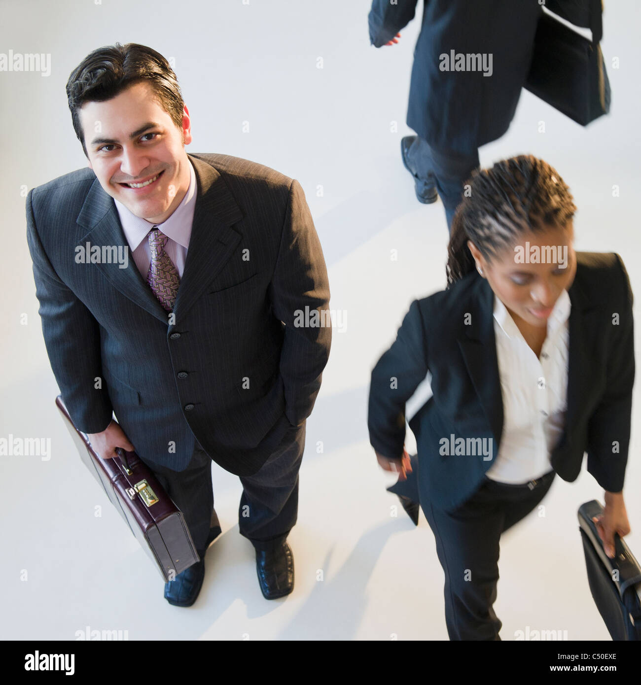 Busy business people walking Stock Photo - Alamy