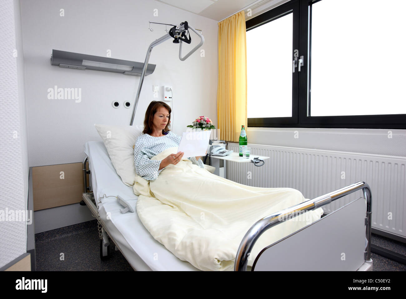 Hospital. Female patient in her bed in a hospital one-bed room Stock ...