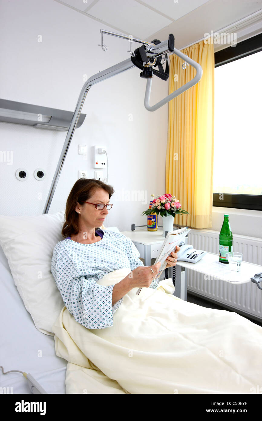 Hospital. Female patient in her bed in a hospital one-bed room Stock ...