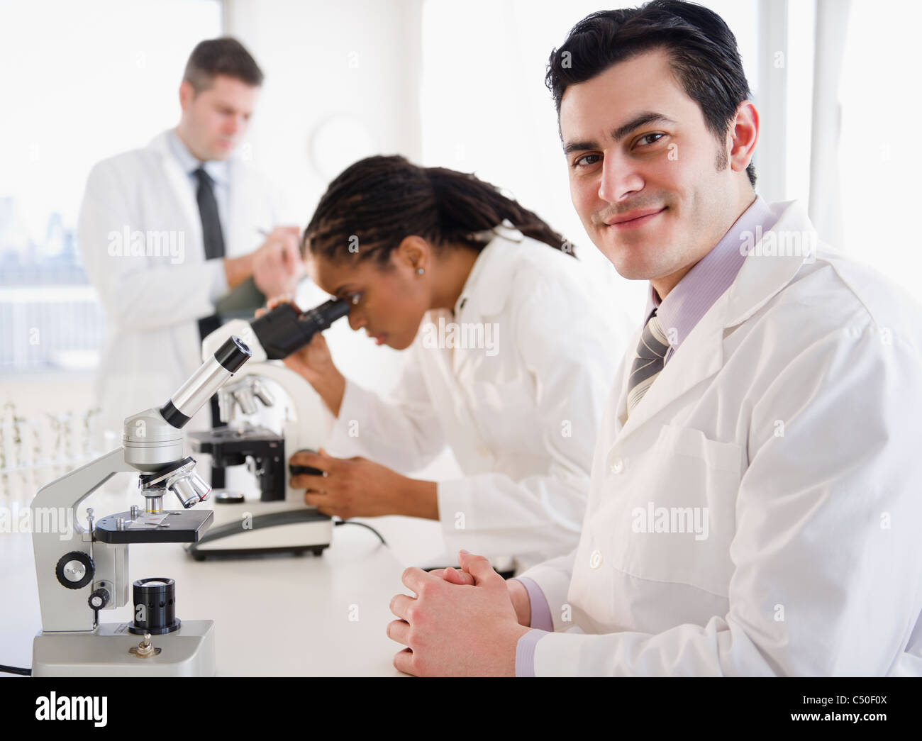 Scientists working in laboratory Stock Photo - Alamy
