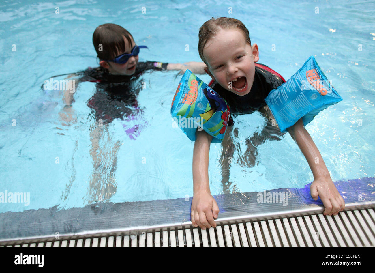 Children swimming in a pool Stock Photo - Alamy