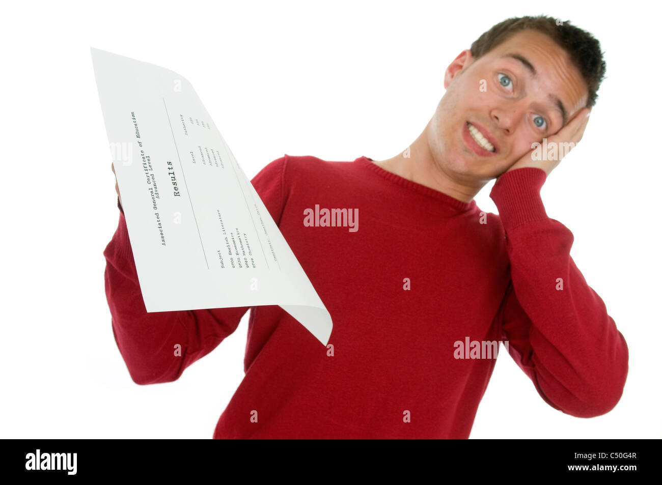 Young man with exam results paper Stock Photo - Alamy