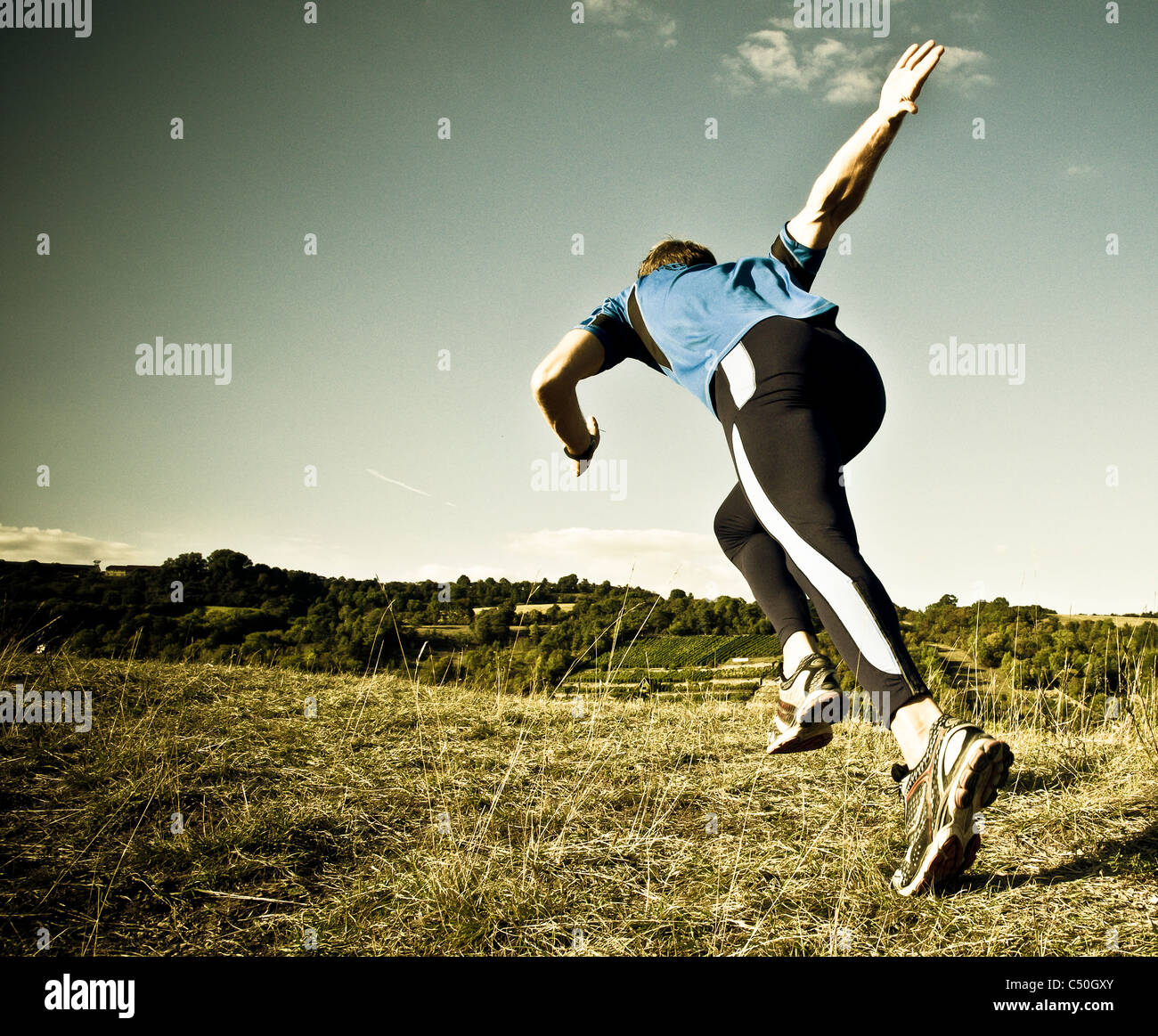 Runner at the start Stock Photo - Alamy