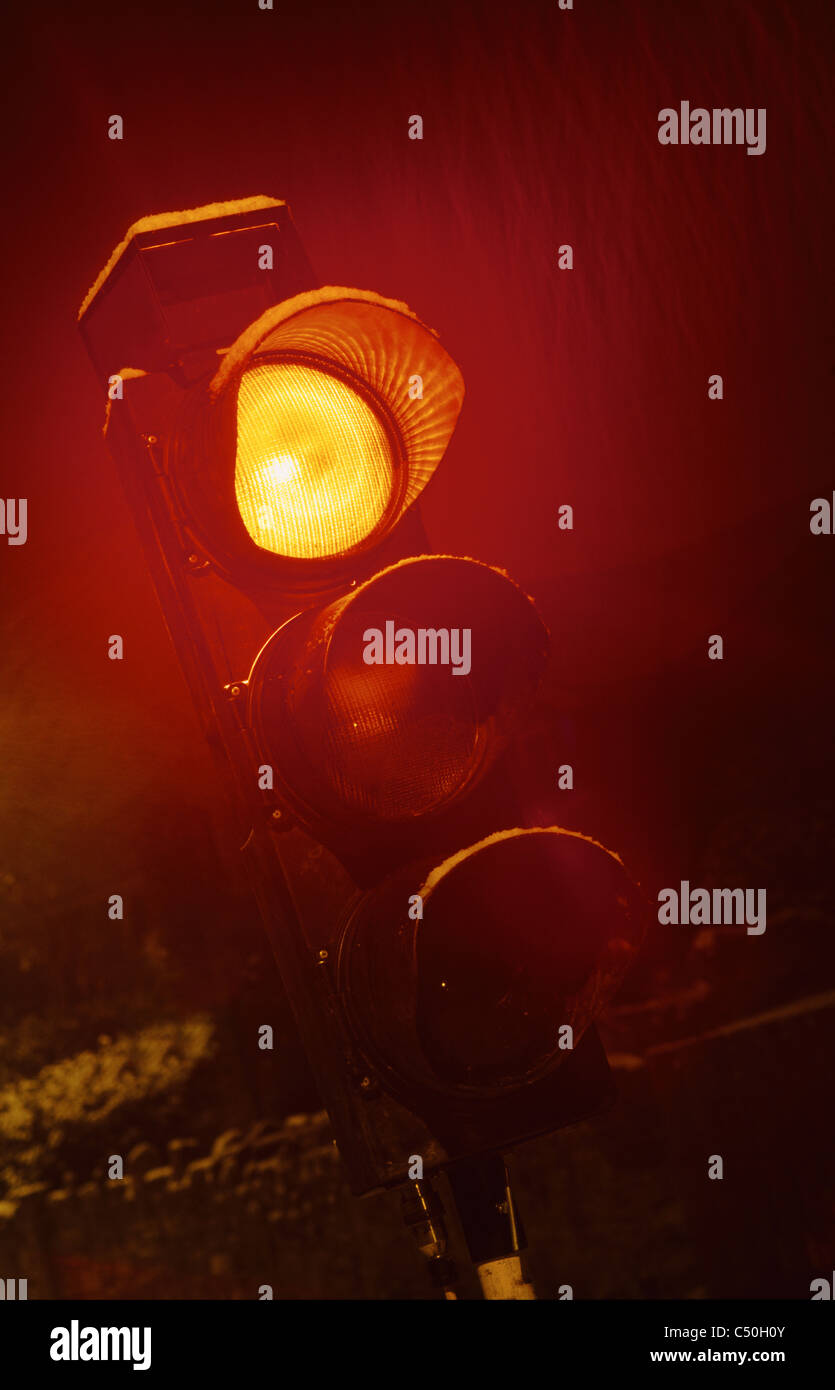 Red Light Showing On Traffic Light At Night Leeds Yorkshire Uk Stock