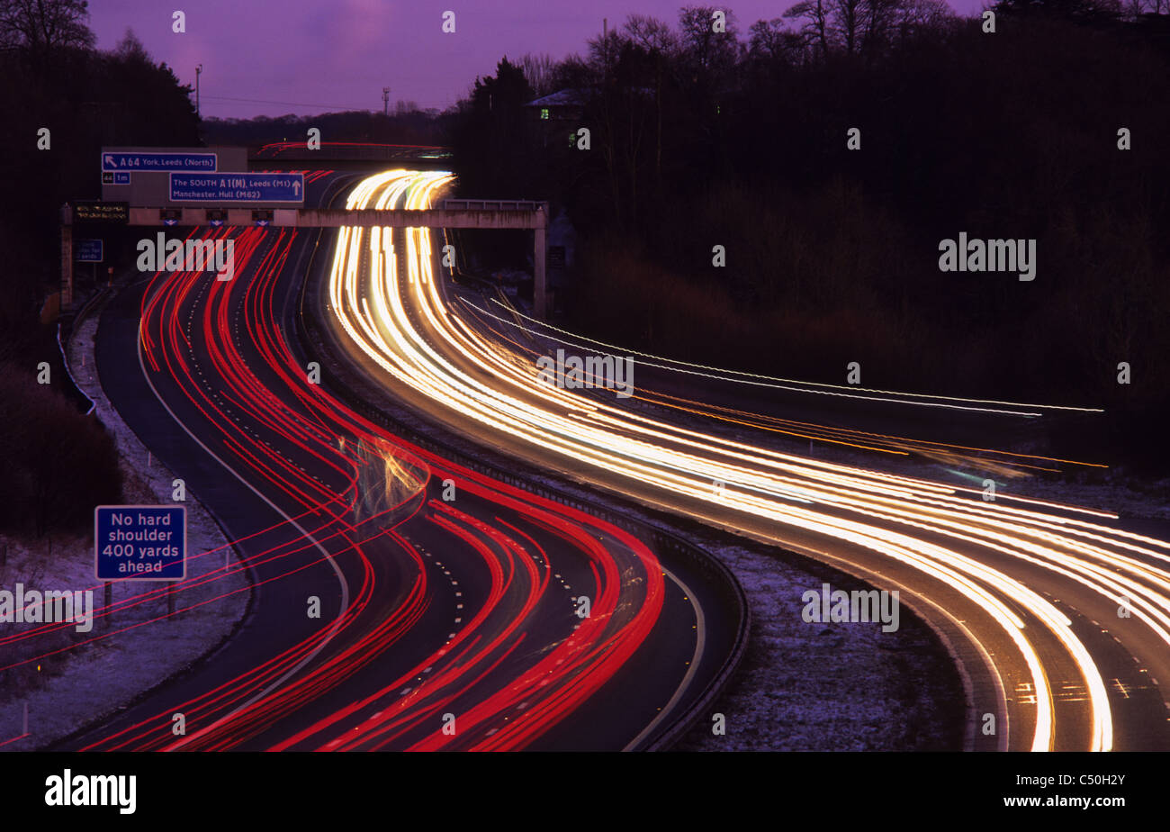 traffic headlight trails at dusk on the A1/M motorway Leeds Yorkshire ...
