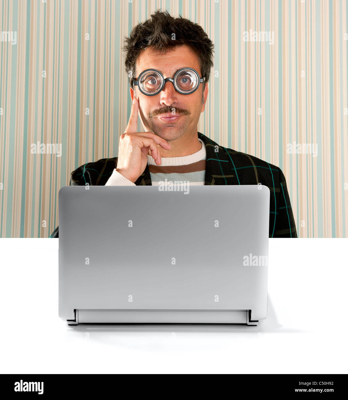 Nerd pensive man with myopic glasses and silly expression in front a ...