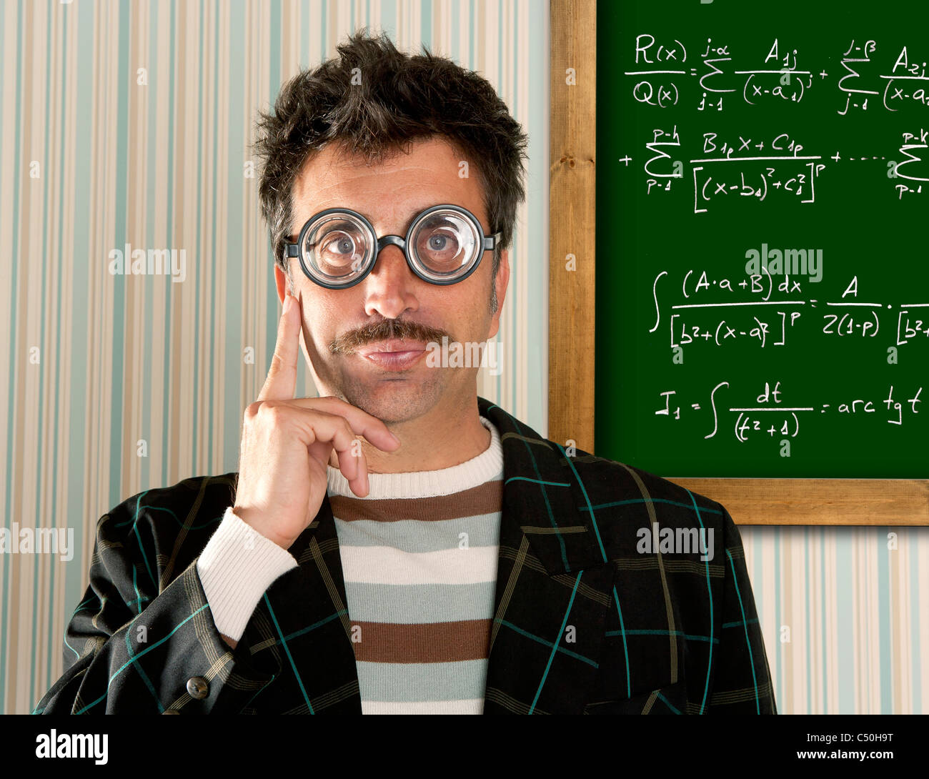 Genius nerd glasses silly man board math formula pensive gesture ...