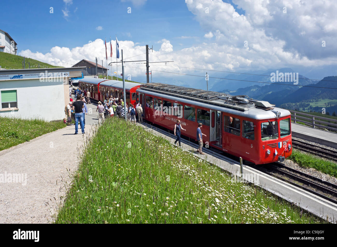 The Rigi Kulm to Vitznau red train is taking on passengers at Rigi Kulm ...