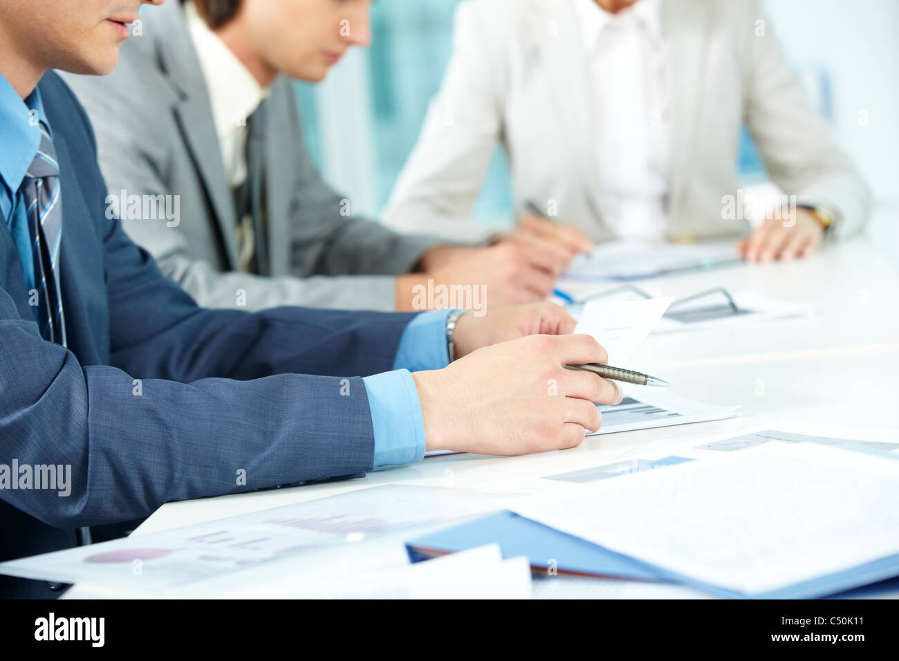 Human hands during paperwork in office Stock Photo - Alamy