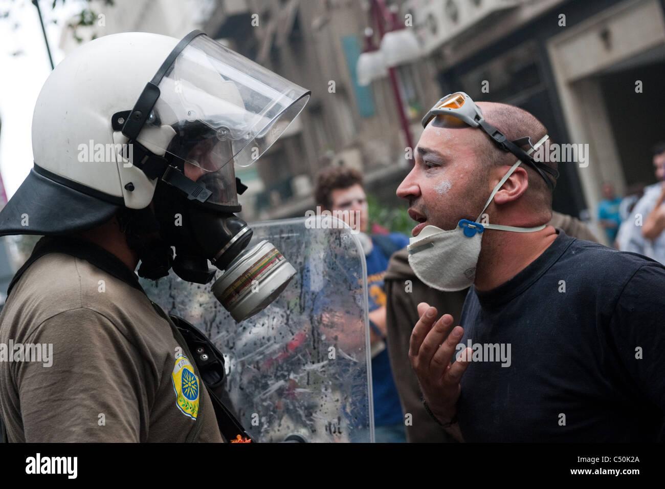 Protesters talking to riot policeman in Karagiorgi Servias street near ...