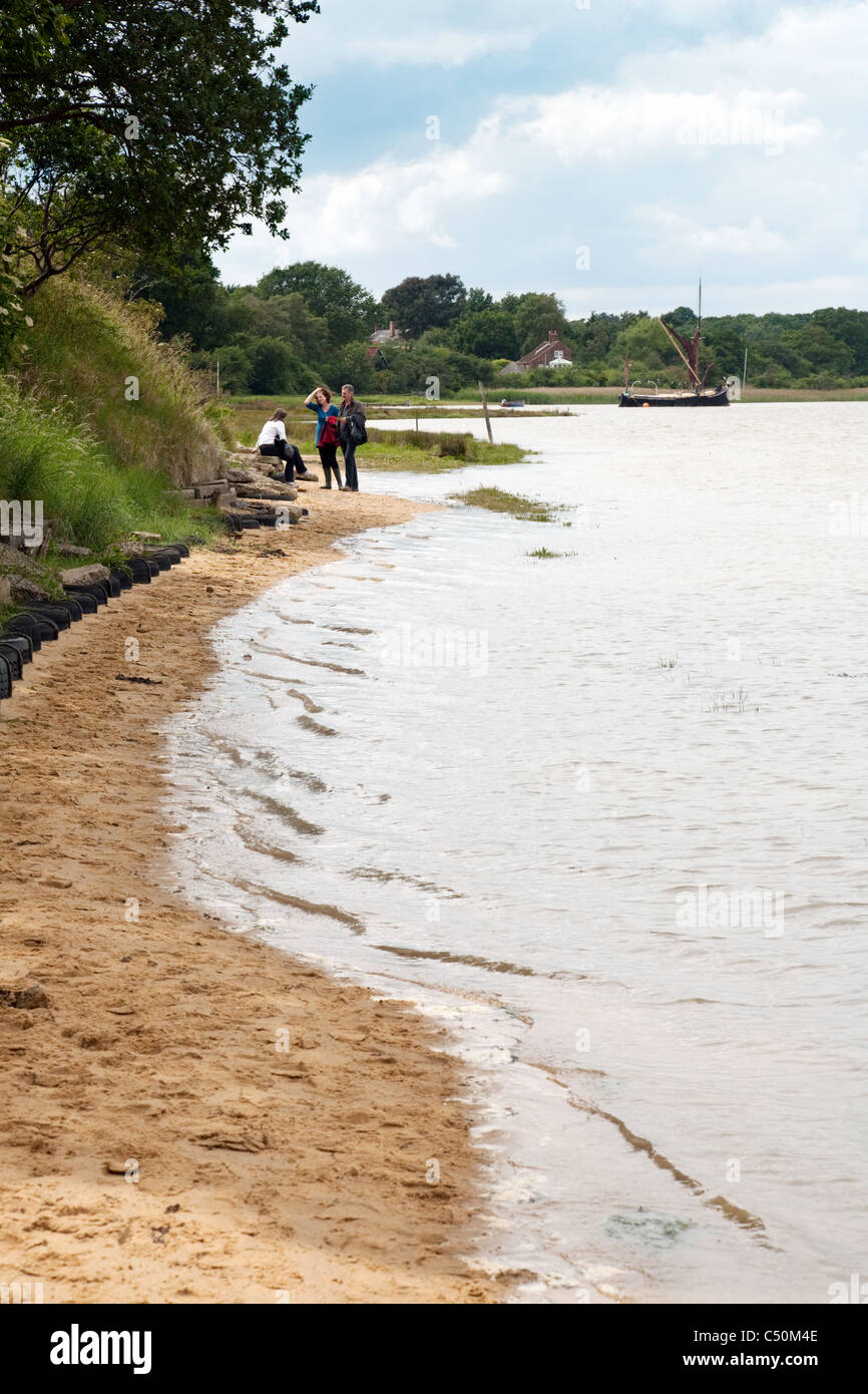People walking the Suffolk Coast path at the River Alde at Iken ...