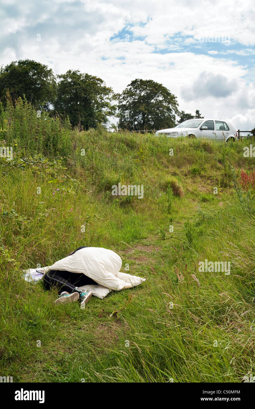 Man sleeping rough in the countryside, Suffolk UK Stock Photo - Alamy