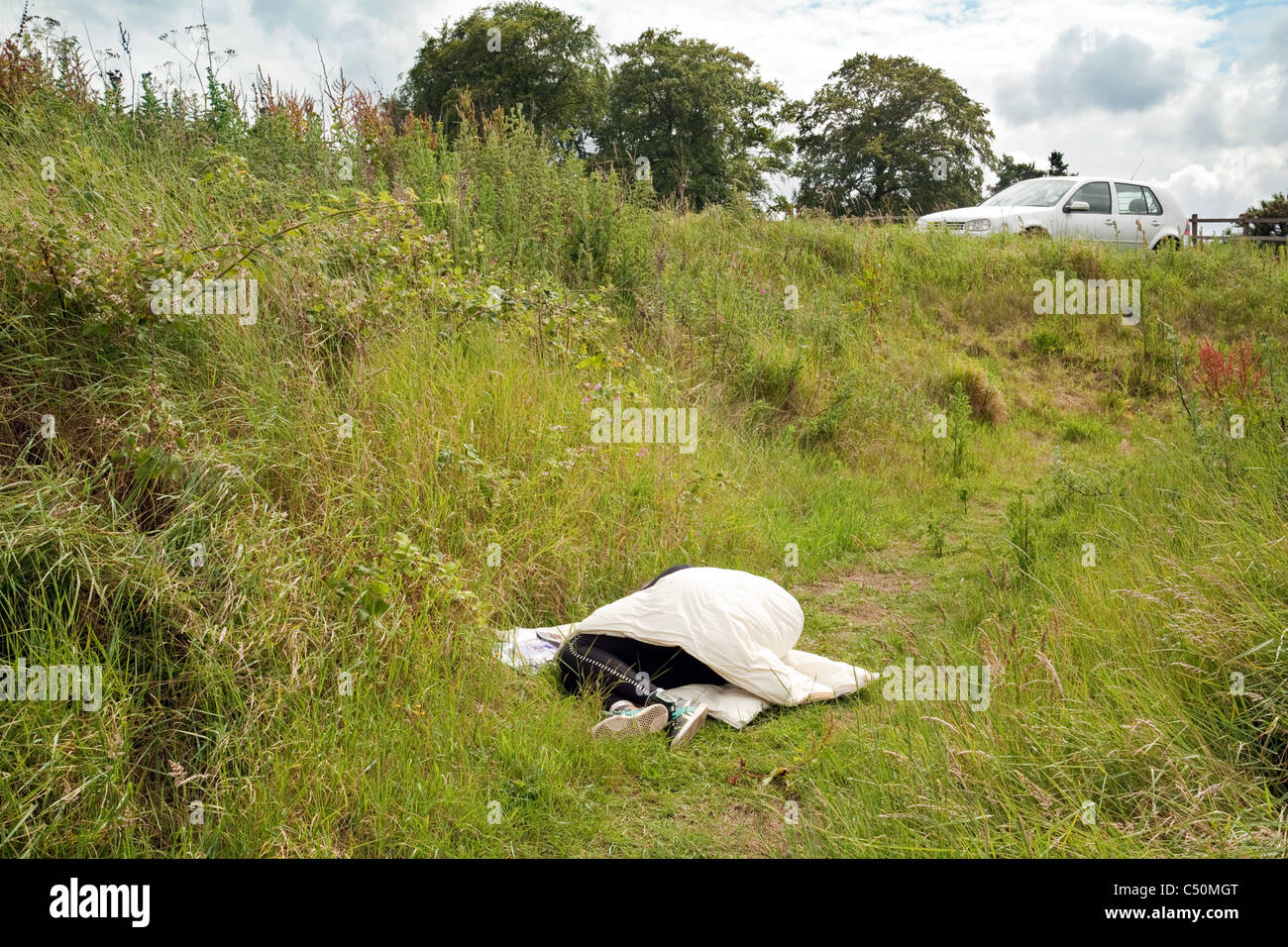 Man sleeping rough in the countryside, Suffolk UK Stock Photo - Alamy