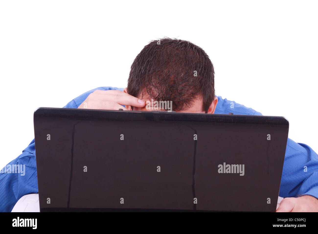 A bald man hiding behind his laptop computer screen Stock Photo - Alamy