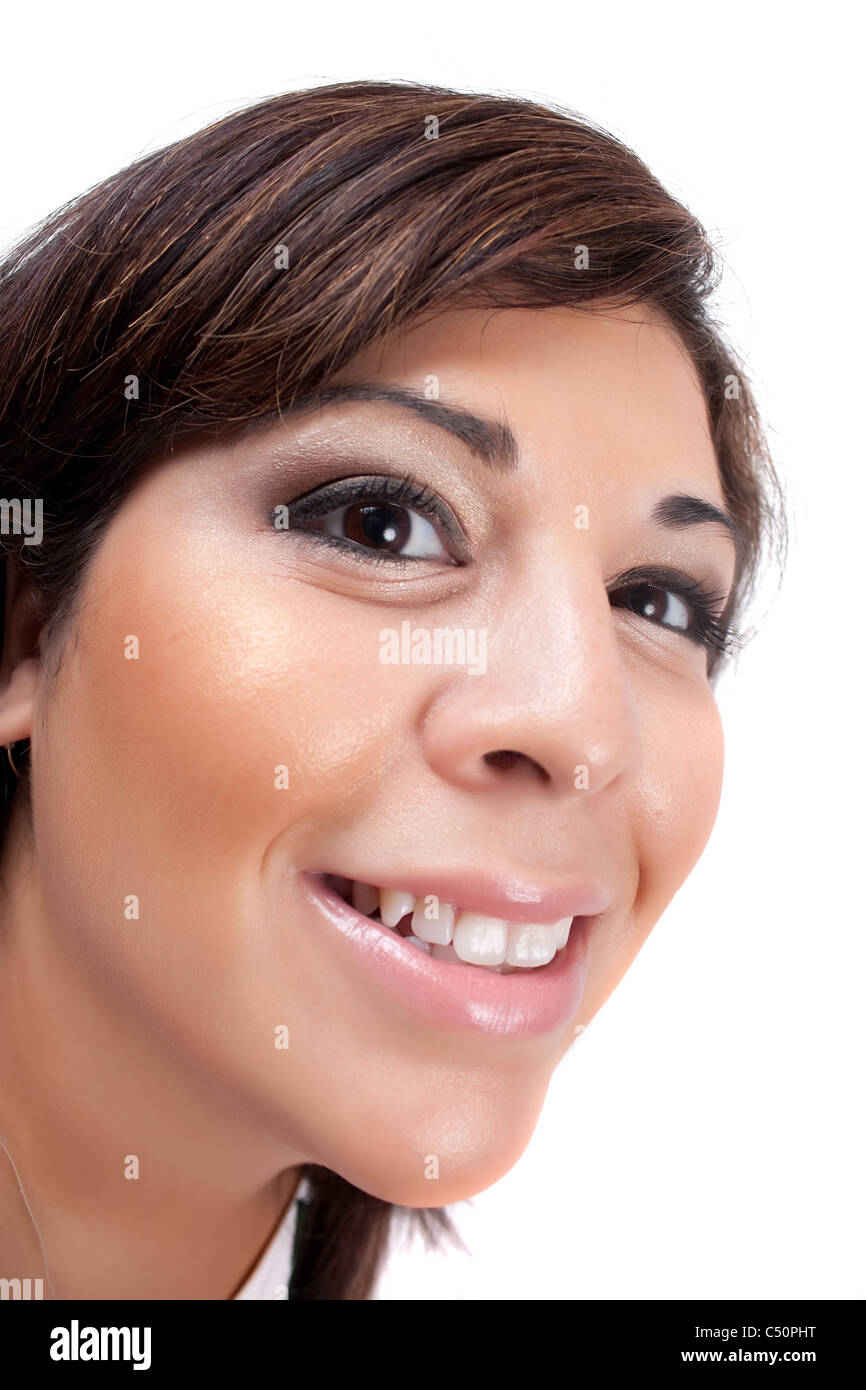 Woman with a happy look on her face smiles over a white background ...