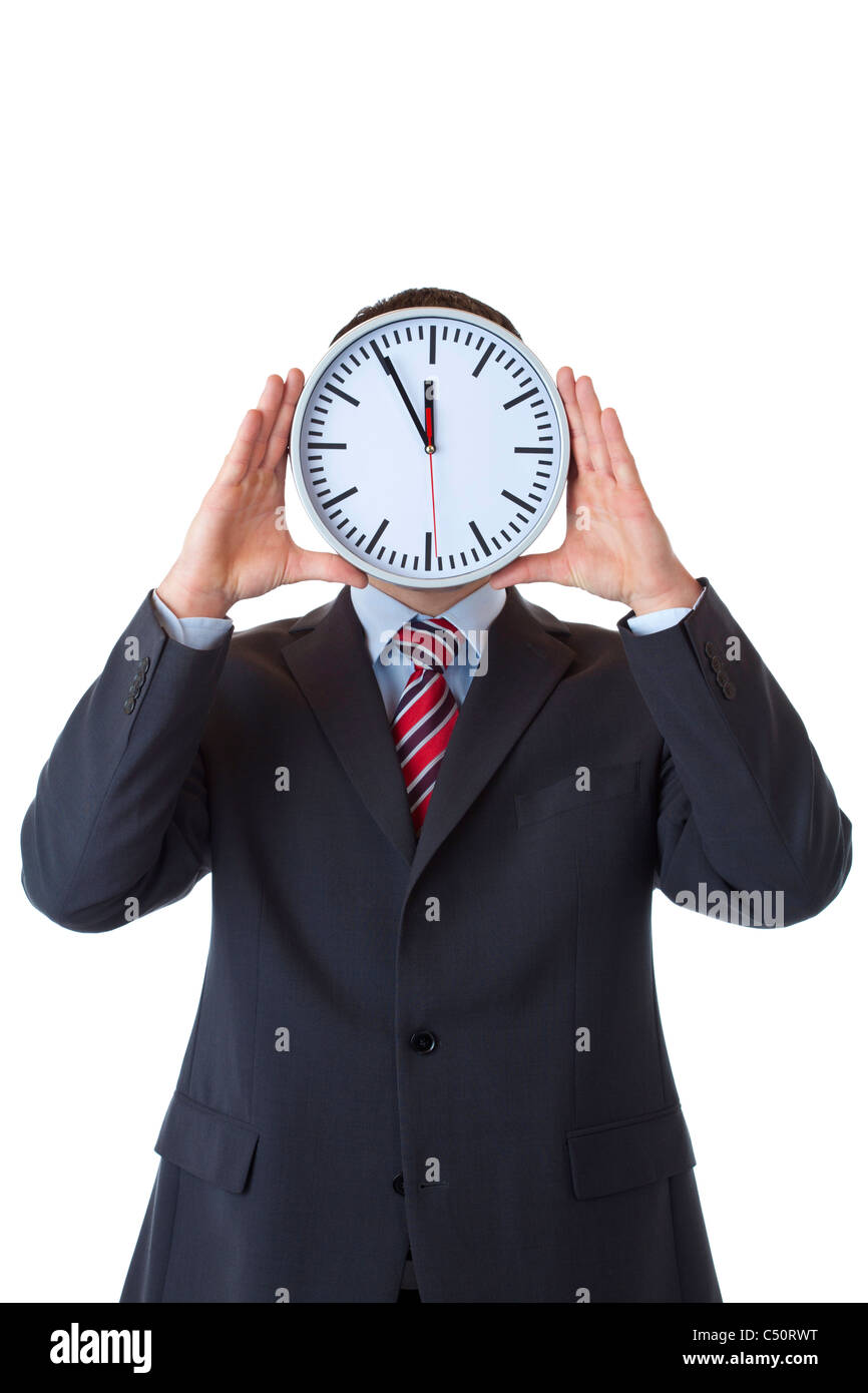 Executive with clock in front of face as a sign of stress.Isolated on ...