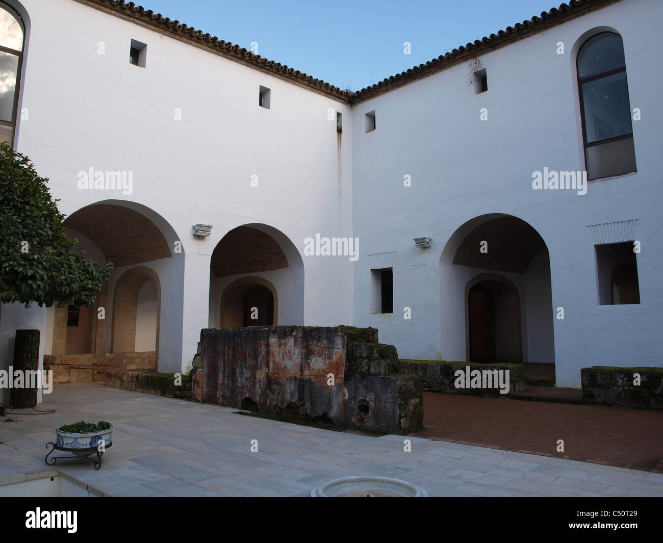 A square in Cordoba by some old dug up ruins Stock Photo - Alamy