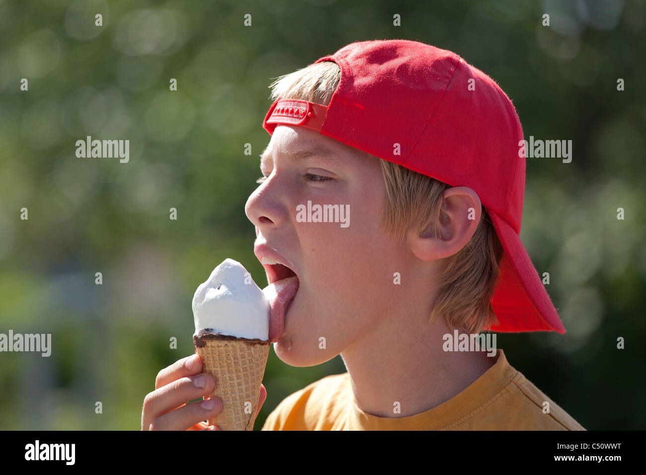 portrait of a young boy eating ice cream Stock Photo - Alamy