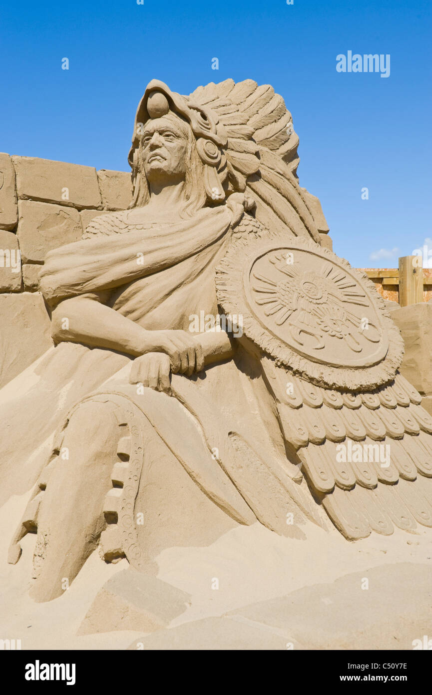 Native Indian at the Sand Sculpture Festival on beach seafront at ...