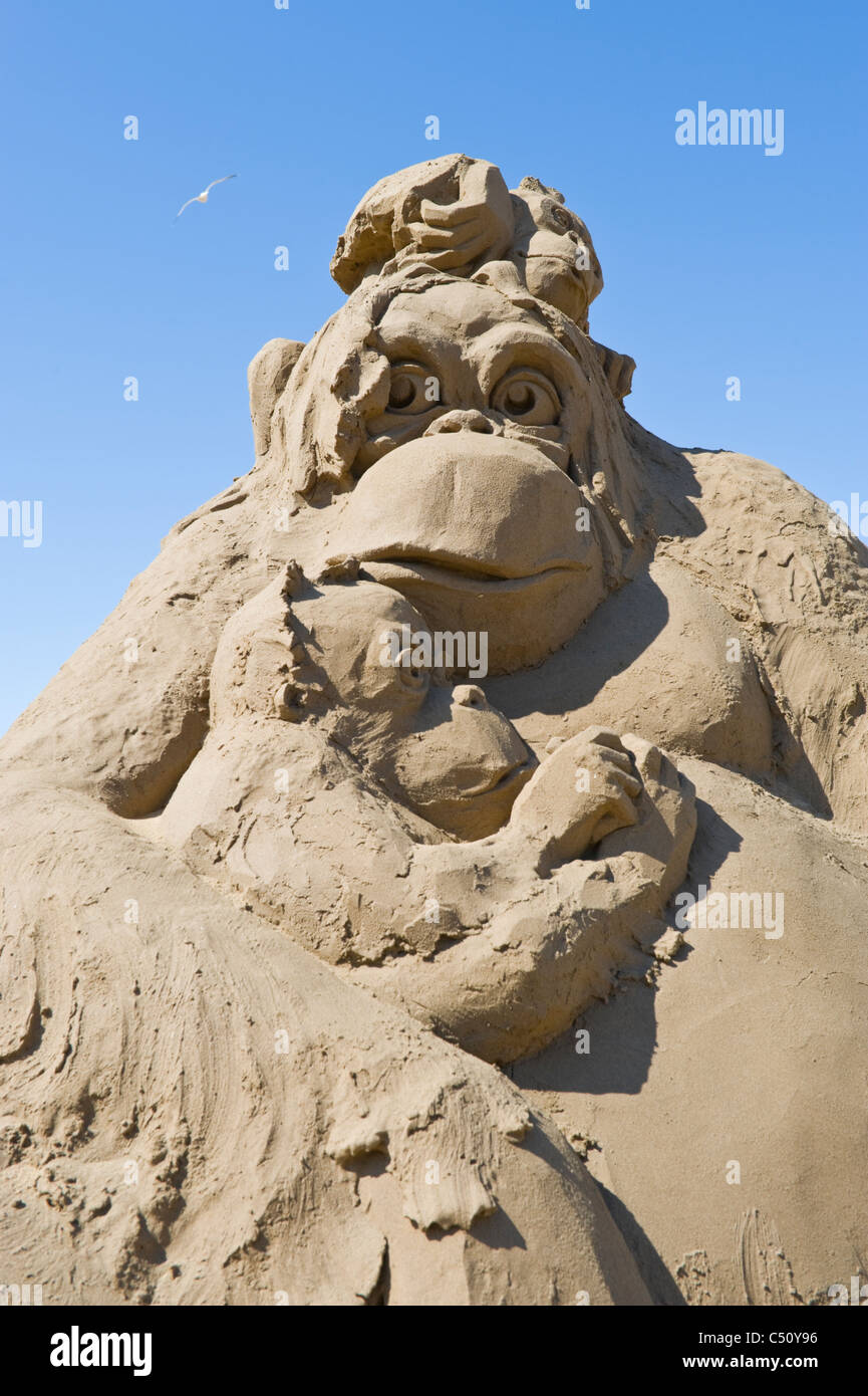 Monkey at Sand Sculpture Festival on beach seafront at Weston Super ...