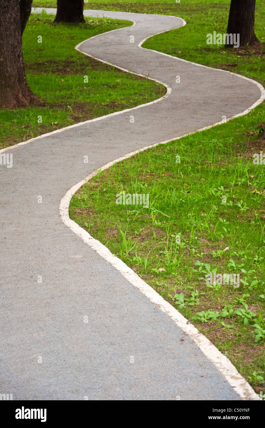A winding path through the park Stock Photo - Alamy