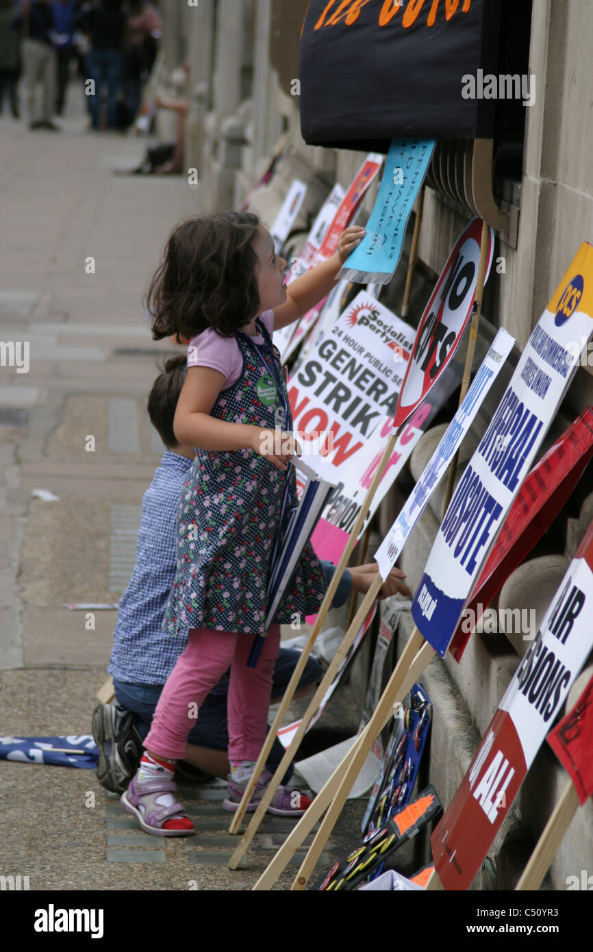 Little girl with placards at Pensions Strike demo 30 June 2011 London ...