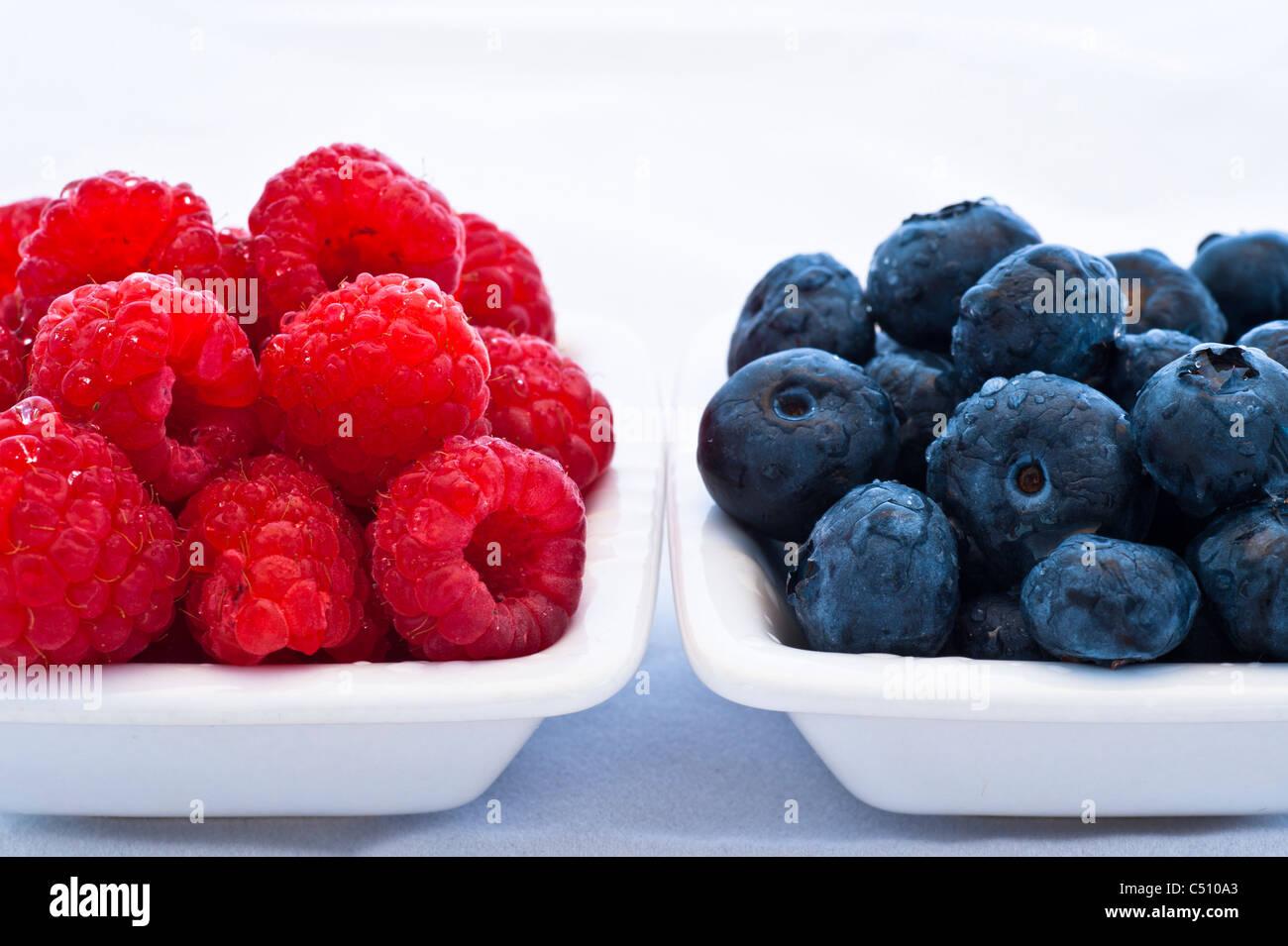 Together blueberries and raspberries Stock Photo - Alamy