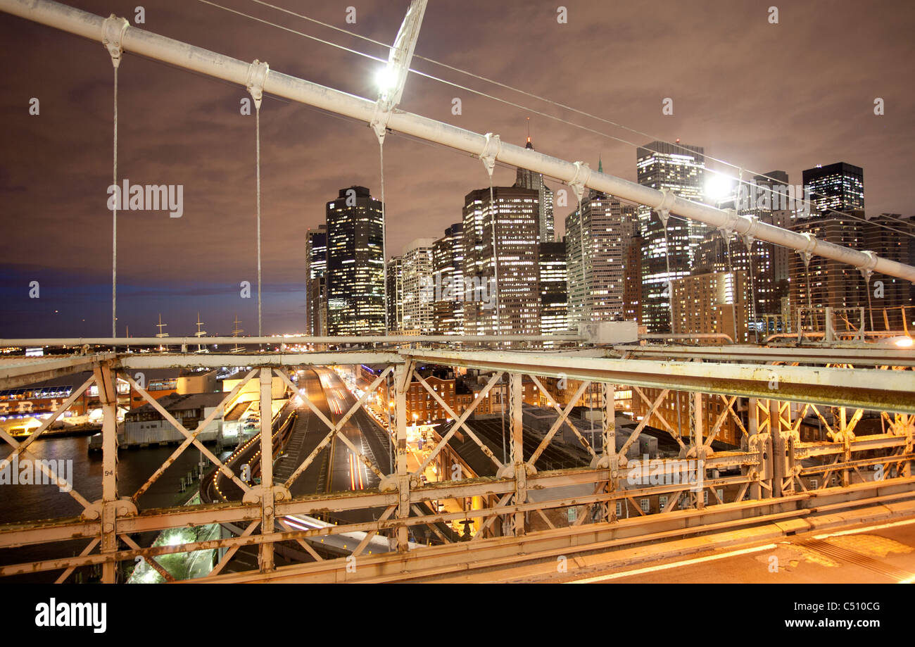 shot of lower manhattan from brooklyn bridge at night Stock Photo - Alamy
