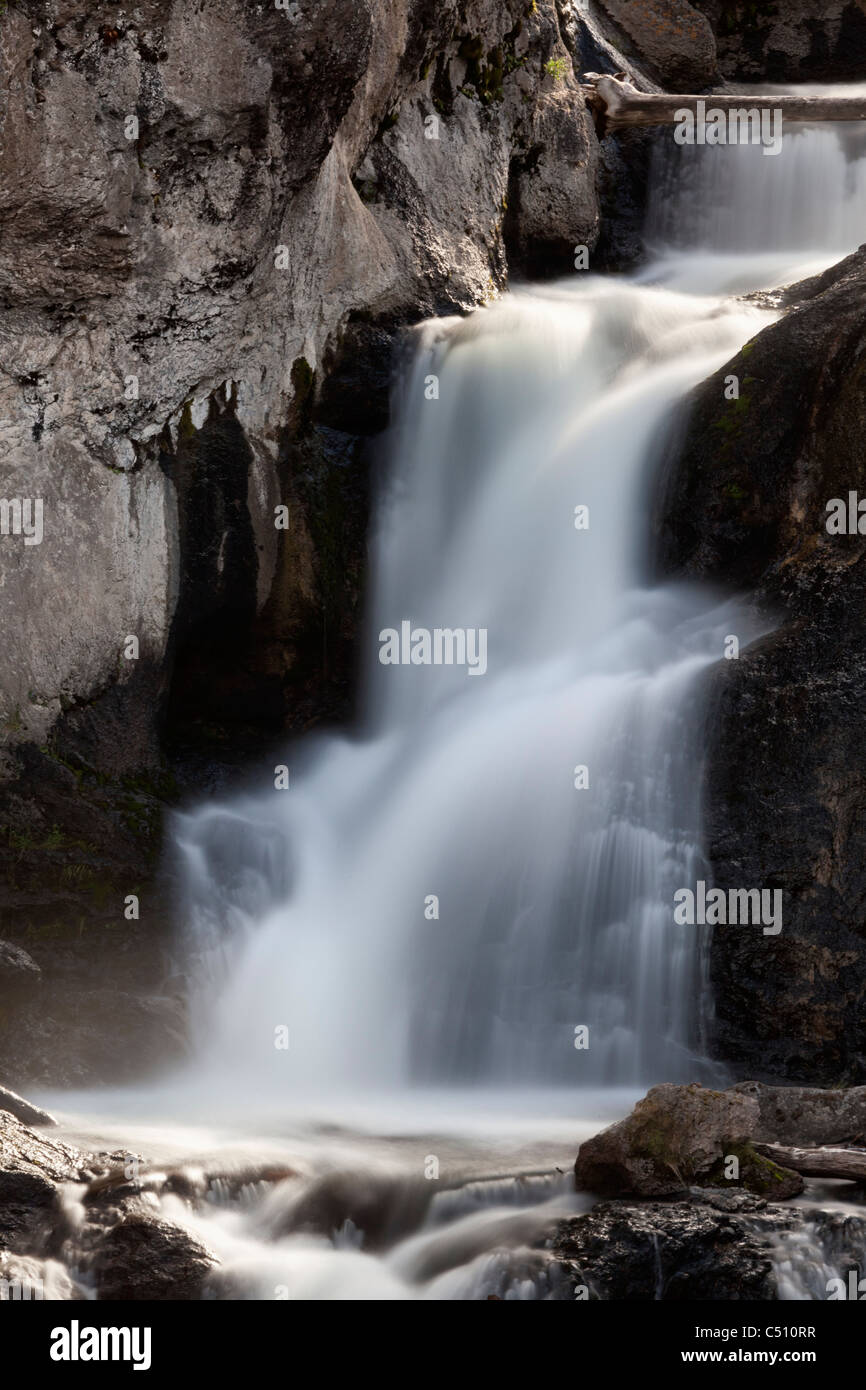 Tall slow motion silky greyscale waterfall evokes mood of peaceful ...