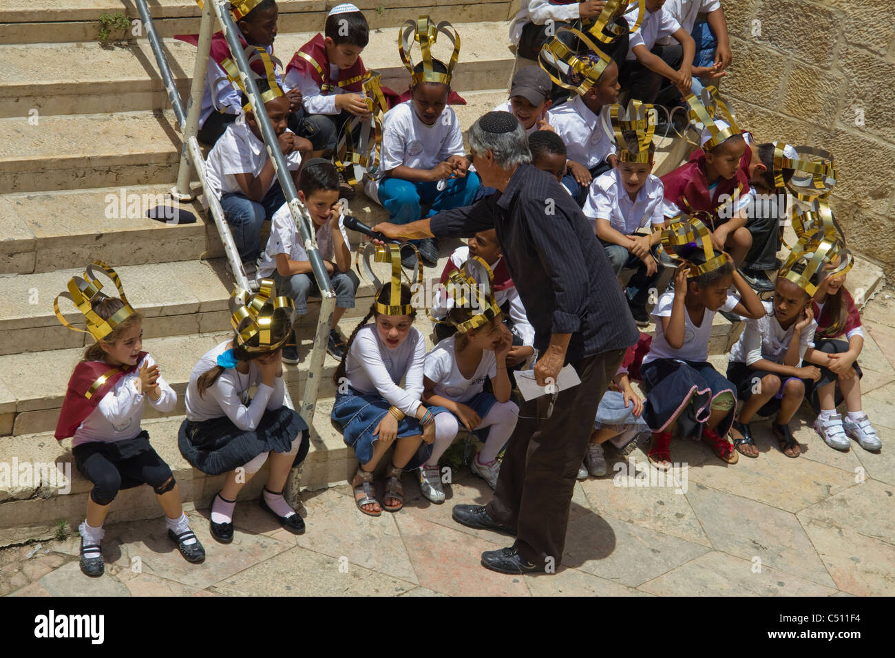 Small Jewish children dressed up on steps in the Jewish Quarter of the ...