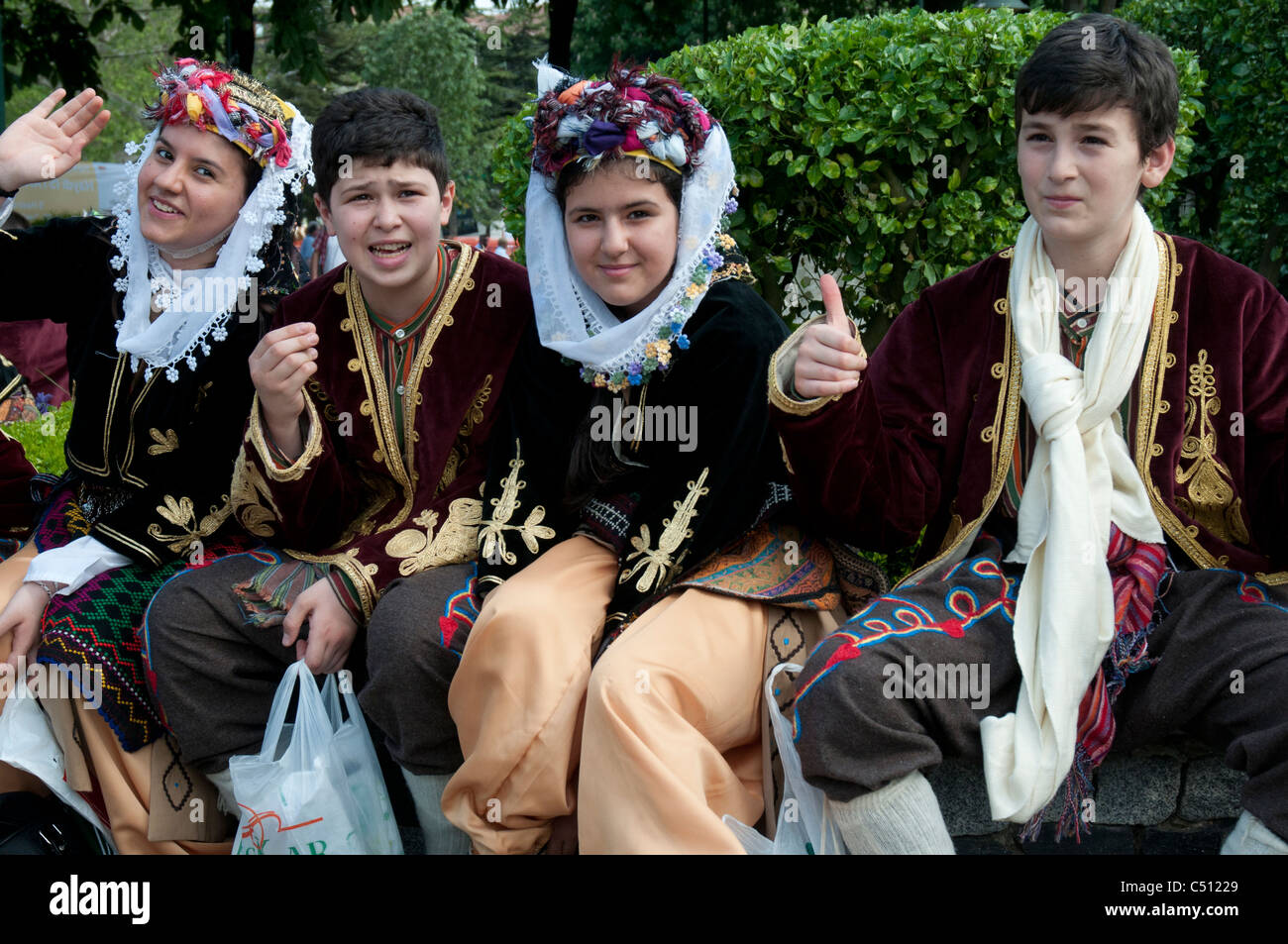 Schoolchildren dressed in regional costumes for a cultural performance ...