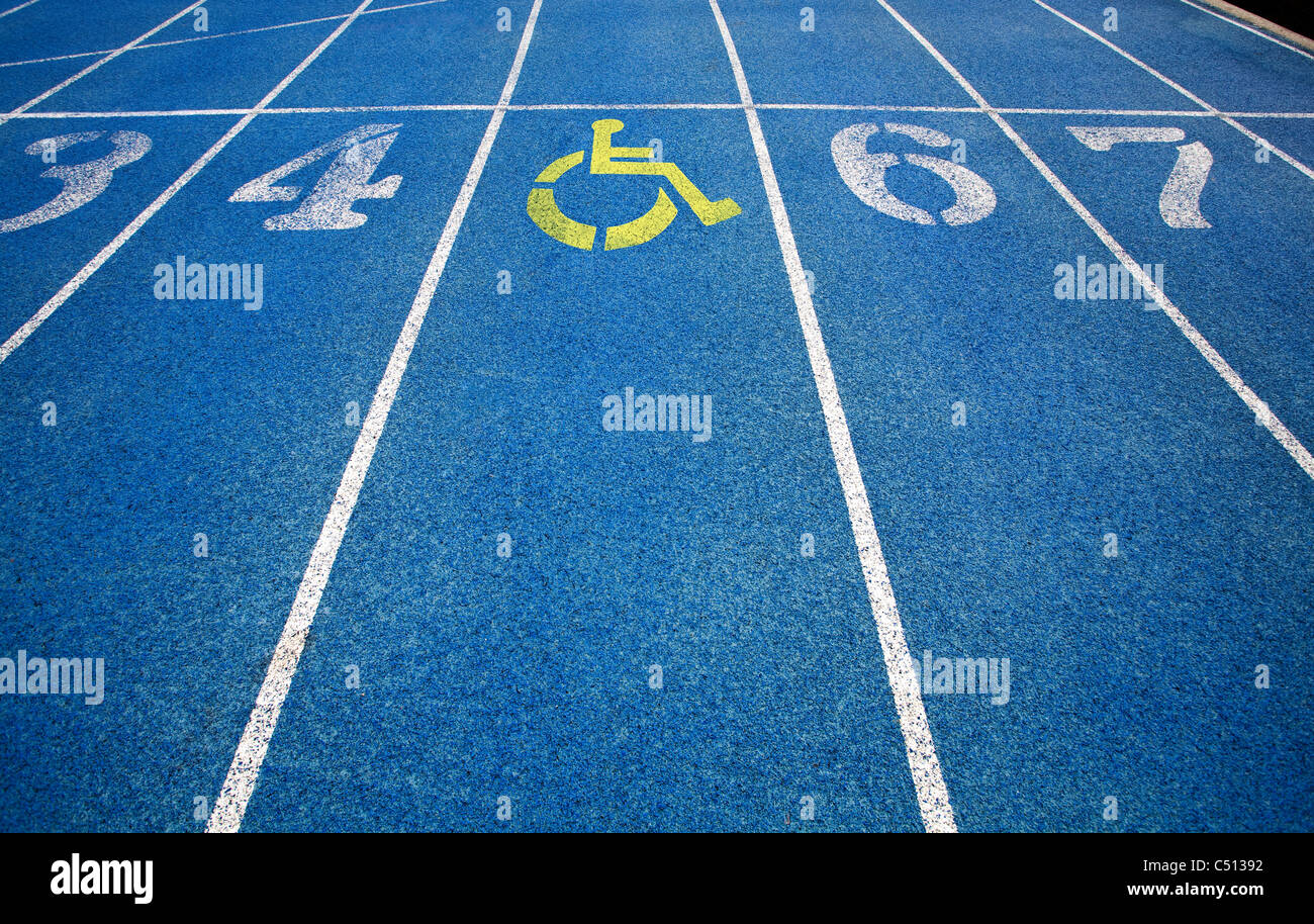 Handicap wheelchair icon superimposed on top of running track Stock ...
