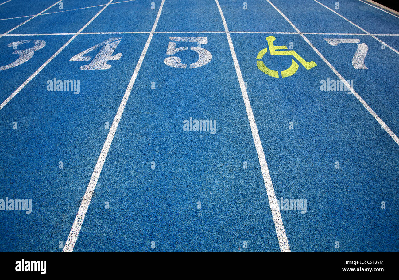 Handicap wheelchair icon superimposed on top of running track Stock ...