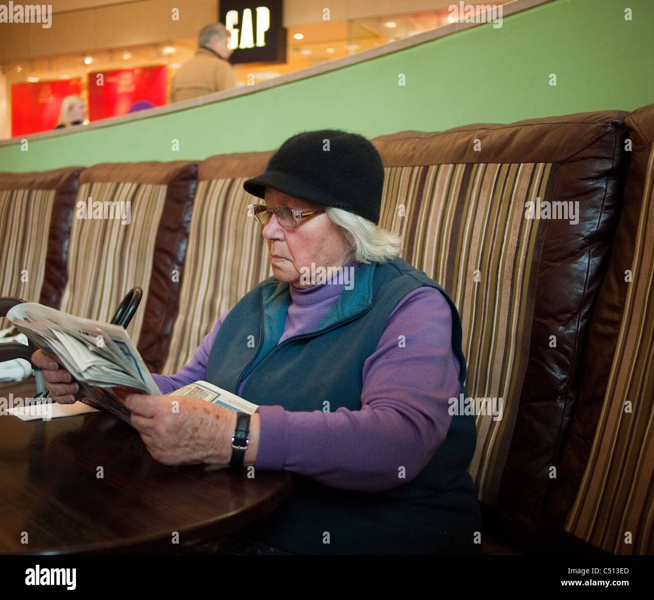 Elderly Lady Reading Newspaper Stock Photo - Alamy