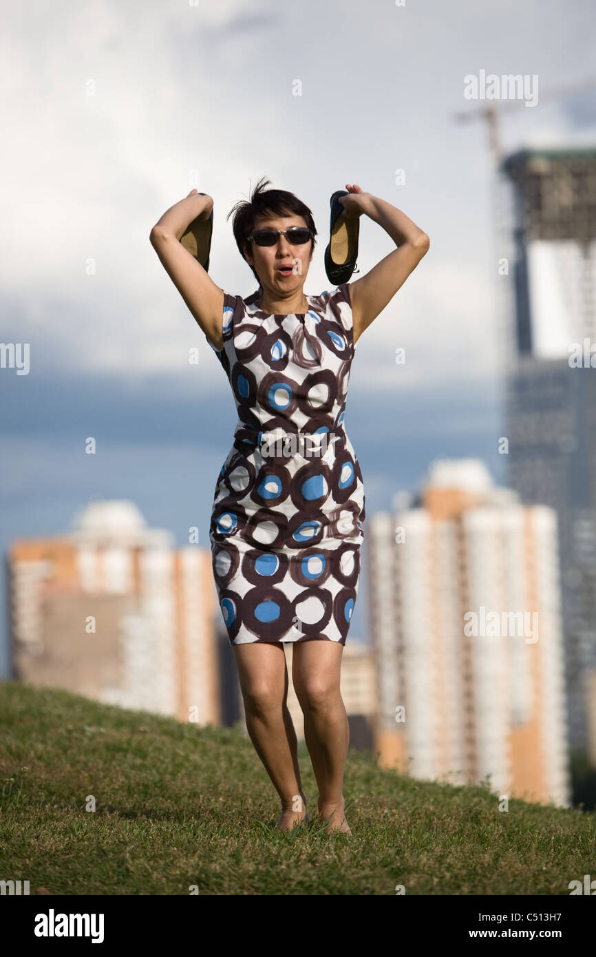 Woman about to throw her shoes Stock Photo - Alamy