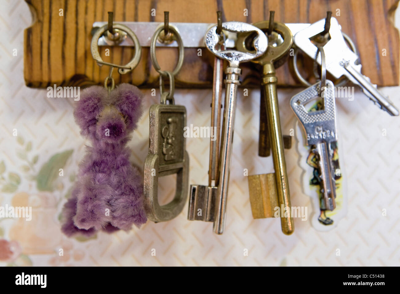 Keys hanging on rack Stock Photo - Alamy