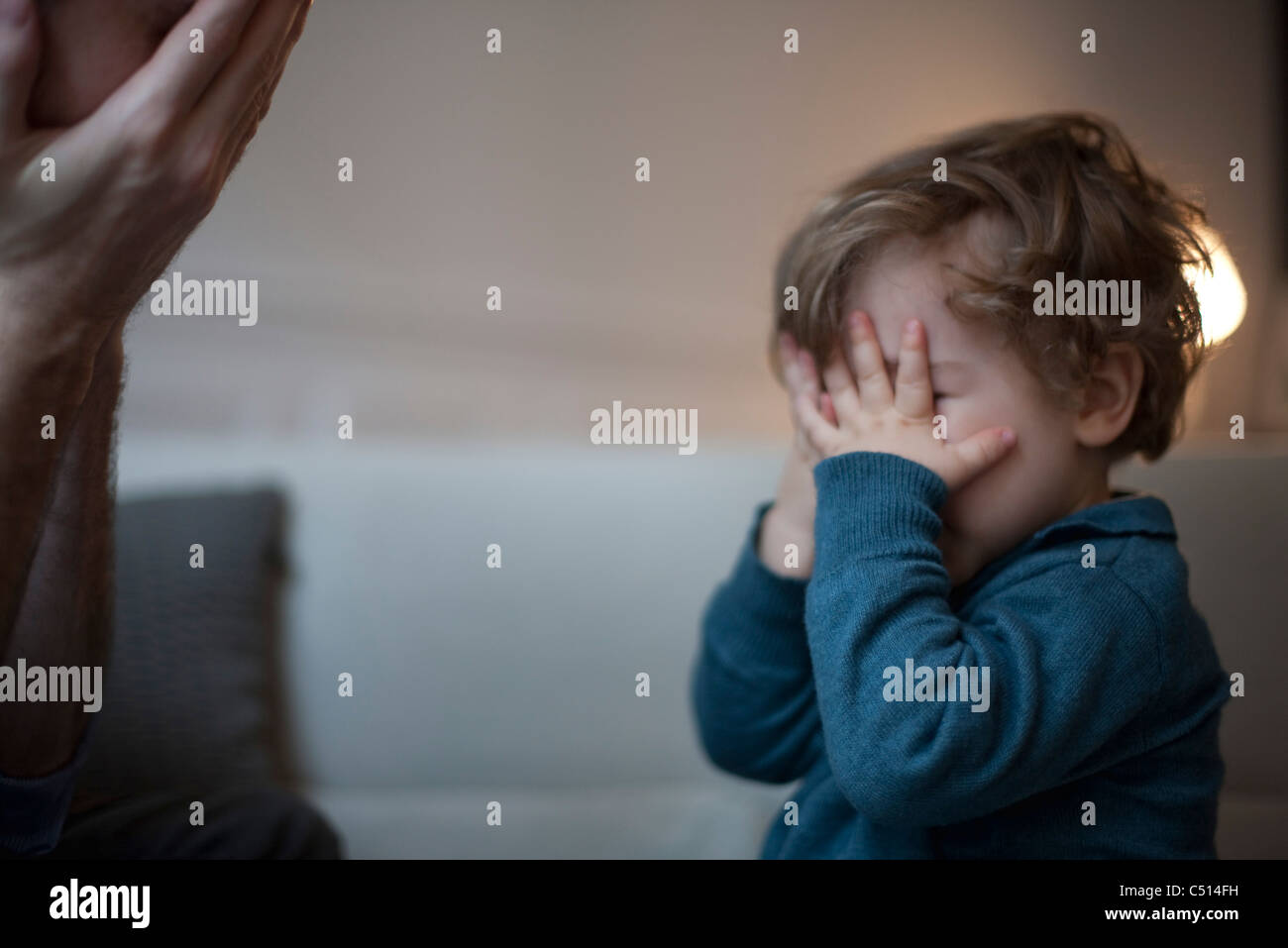 Son covering fathers eyes hi-res stock photography and images - Alamy
