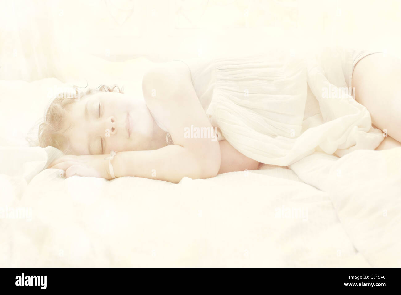 Little girl napping with smile Stock Photo - Alamy