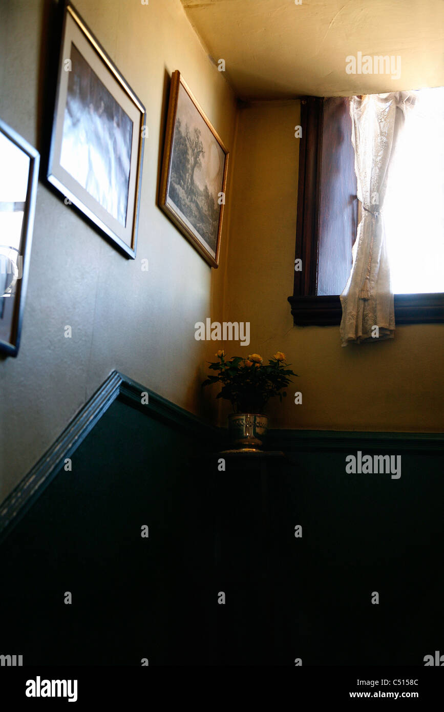 Staircase leading up to window Stock Photo - Alamy