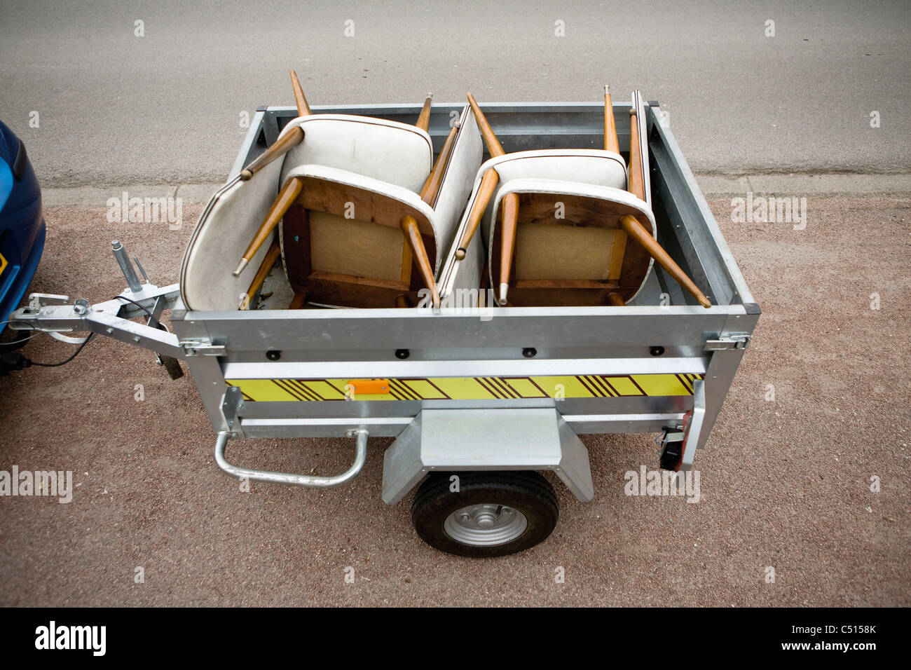 Chairs being transported in trailer Stock Photo - Alamy