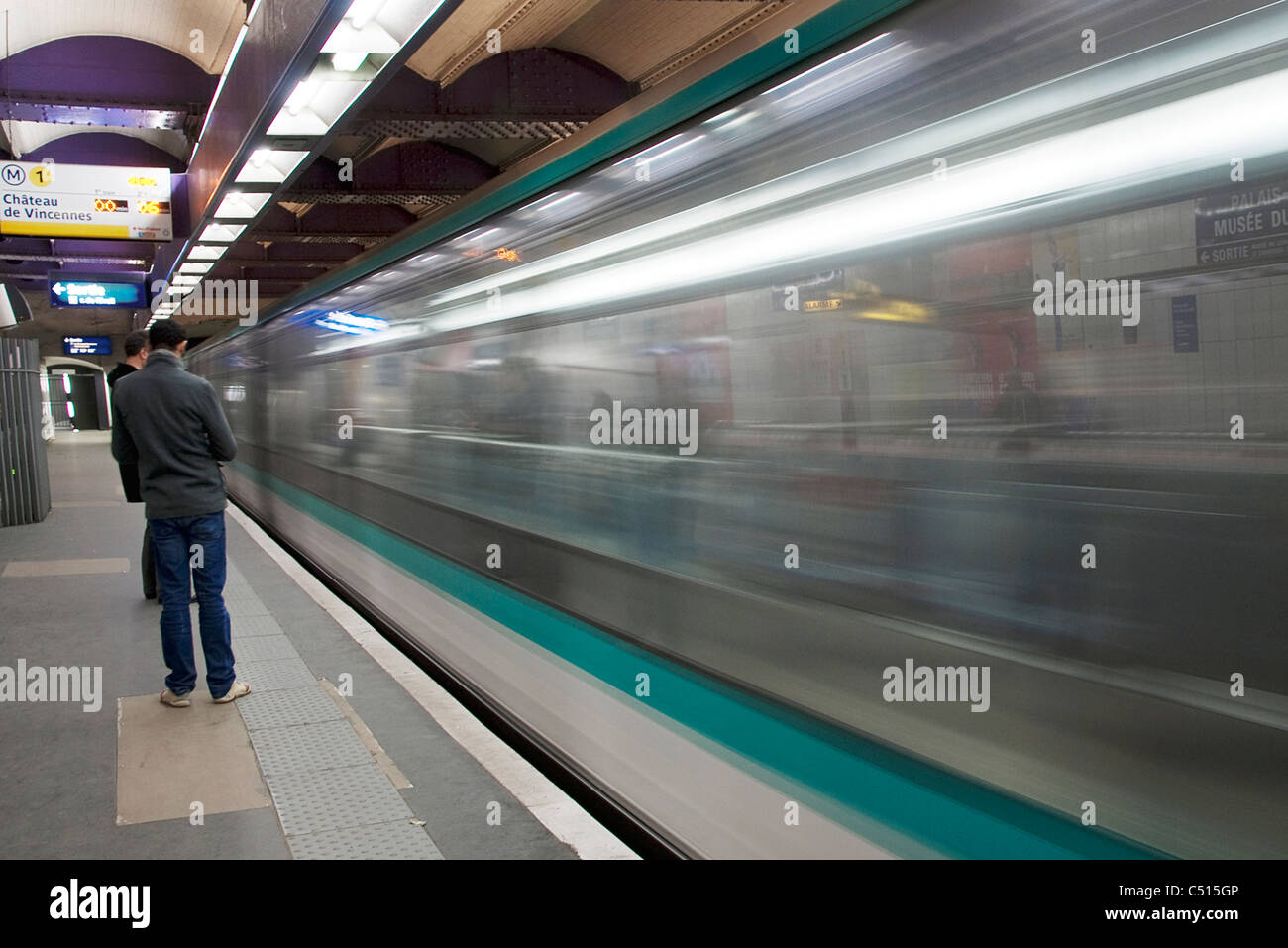 Men waiting on subway platform, paris Stock Photo - Alamy