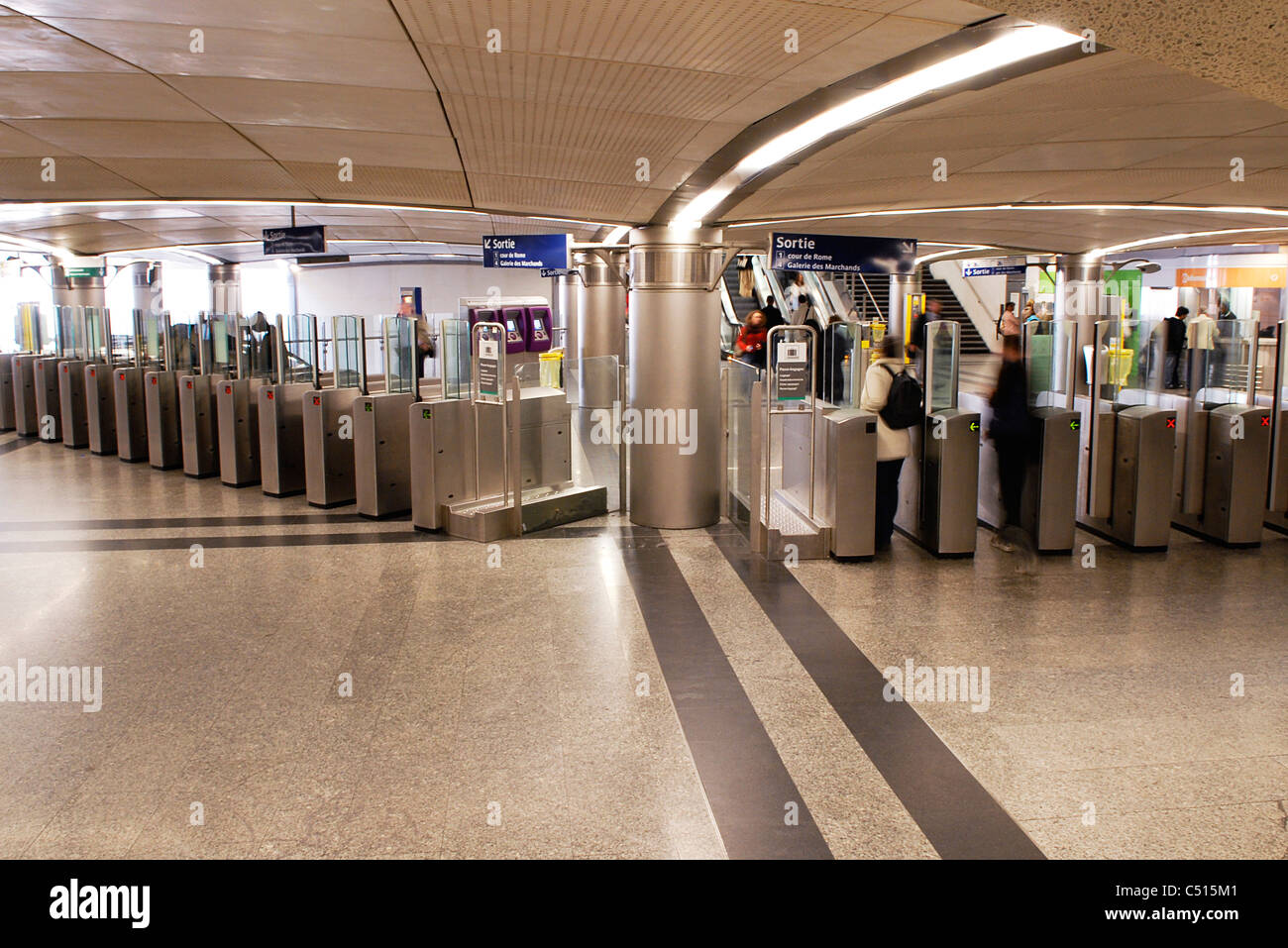 People going through turnstiles in subway station Stock Photo - Alamy